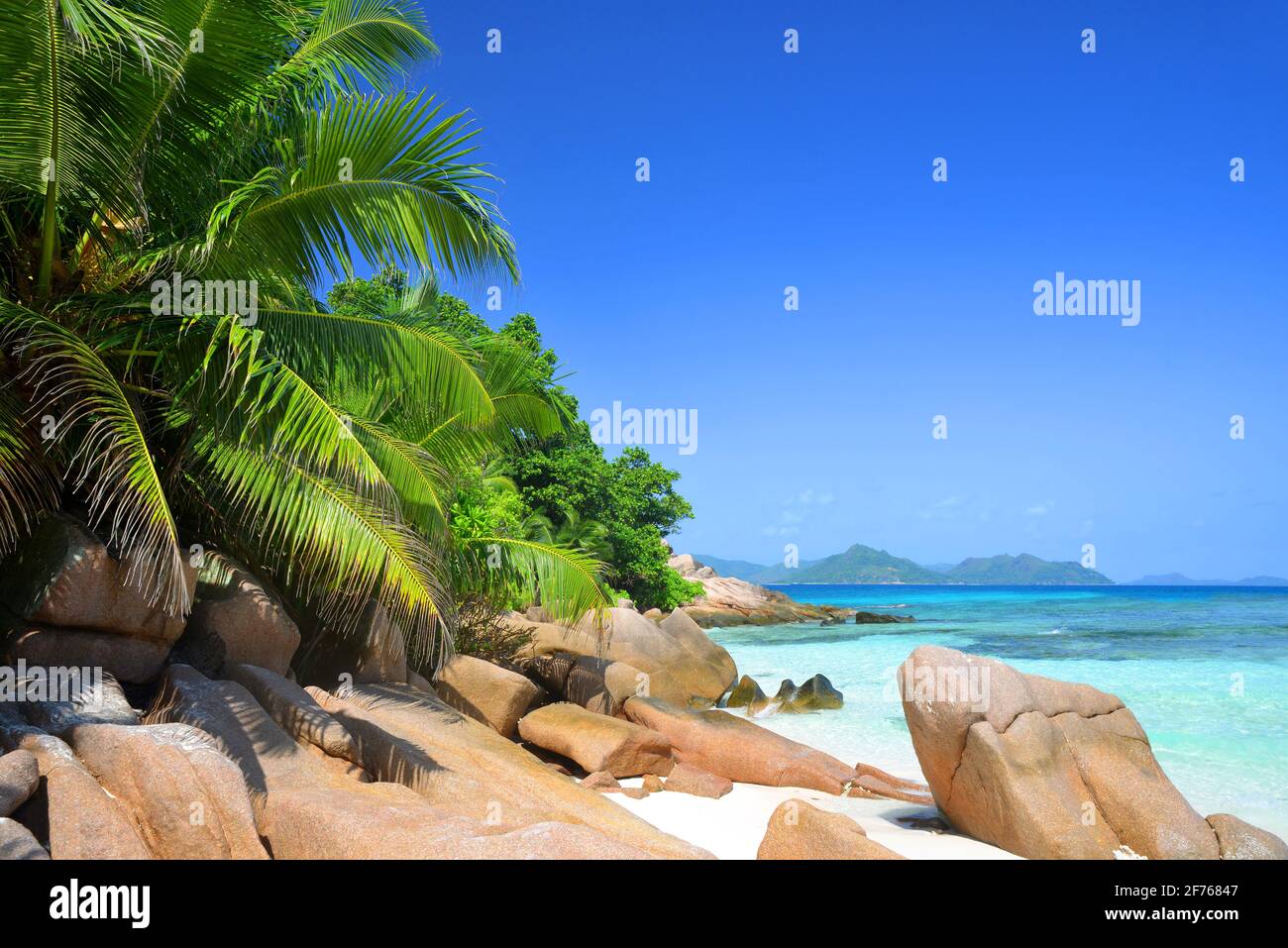 Coast with big granite boulders of the tropical island La Digue, Anse ...