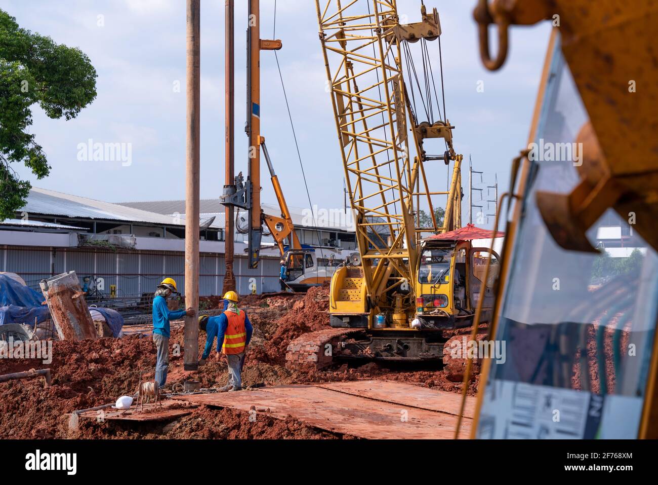 Construction Worker Concrete Pouring During Commercial Concreting