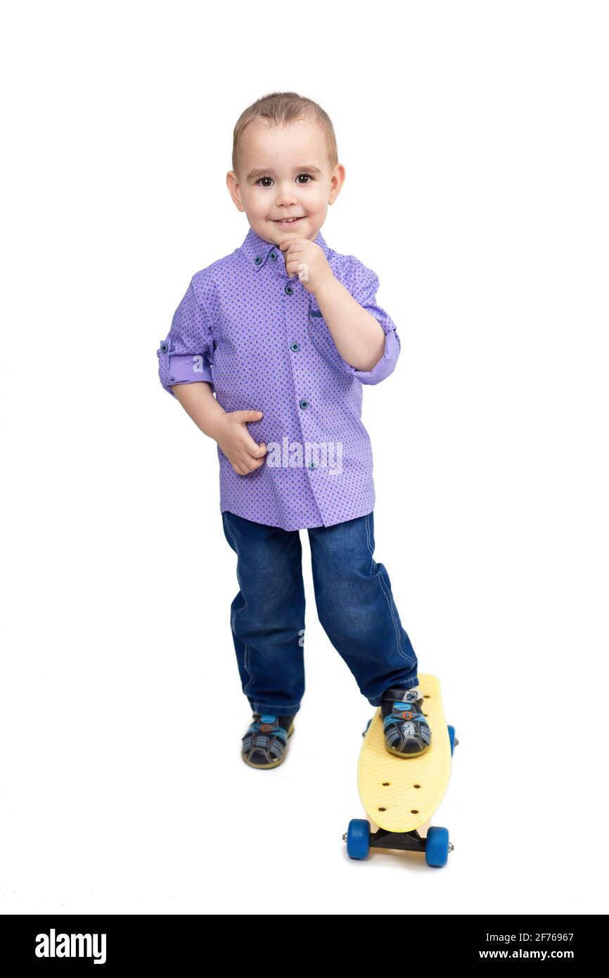 Little boy riding a skateboard isolated White background Stock Photo ...