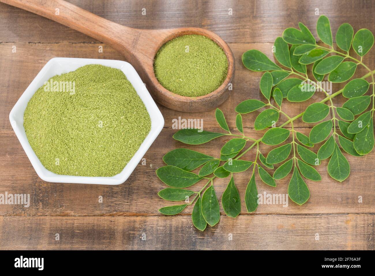 Fresh leaves and moringa powder - Moringa oleifera. Top view Stock ...