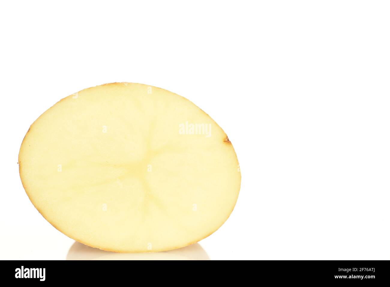 One half fresh, not peeled, raw, organic, juicy potato, macro, on a ...