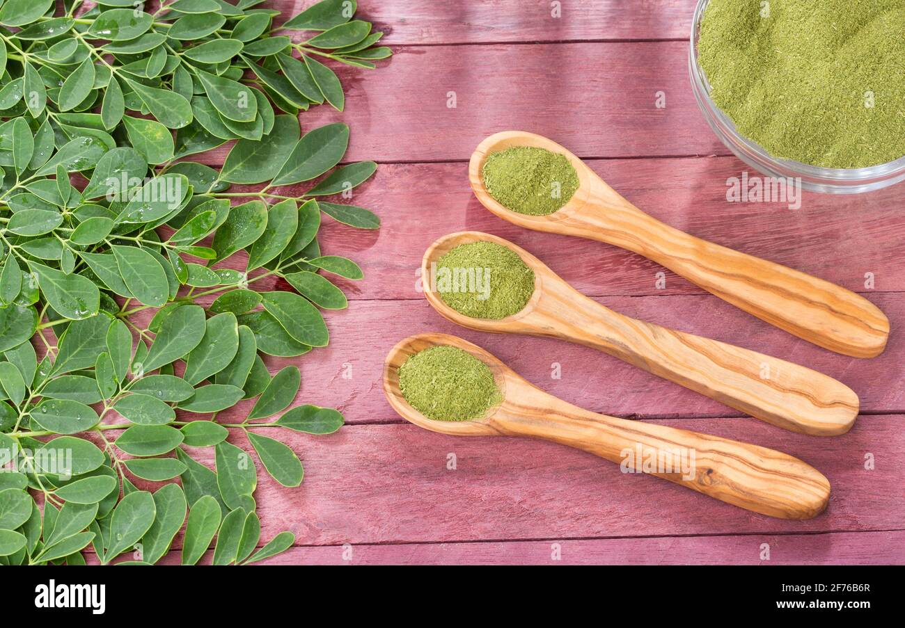 Fresh leaves and moringa powder - Moringa oleifera. Top view Stock ...