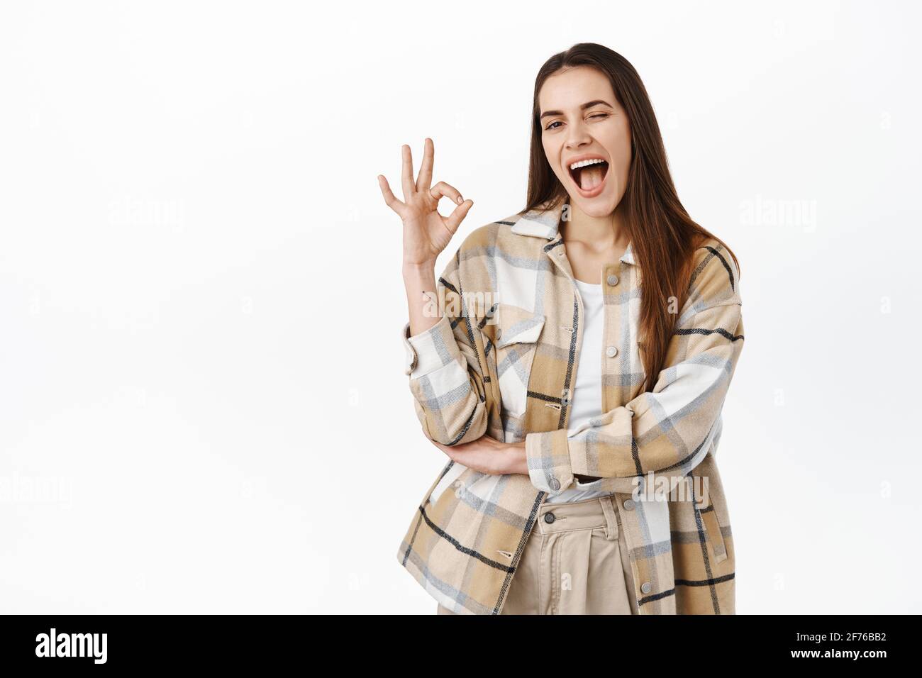 Yes thats okay. Smiling happy woman winking and showing OK agree ...