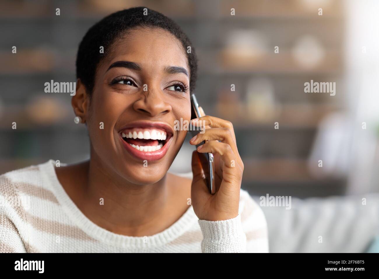 Female home talking phone smiling hi-res stock photography and images ...