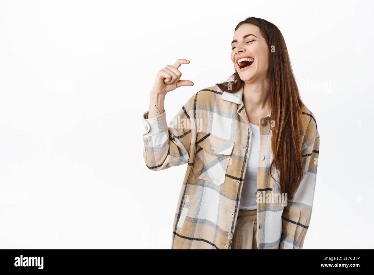 Image of beautiful candid woman holding small little thing, laughing ...