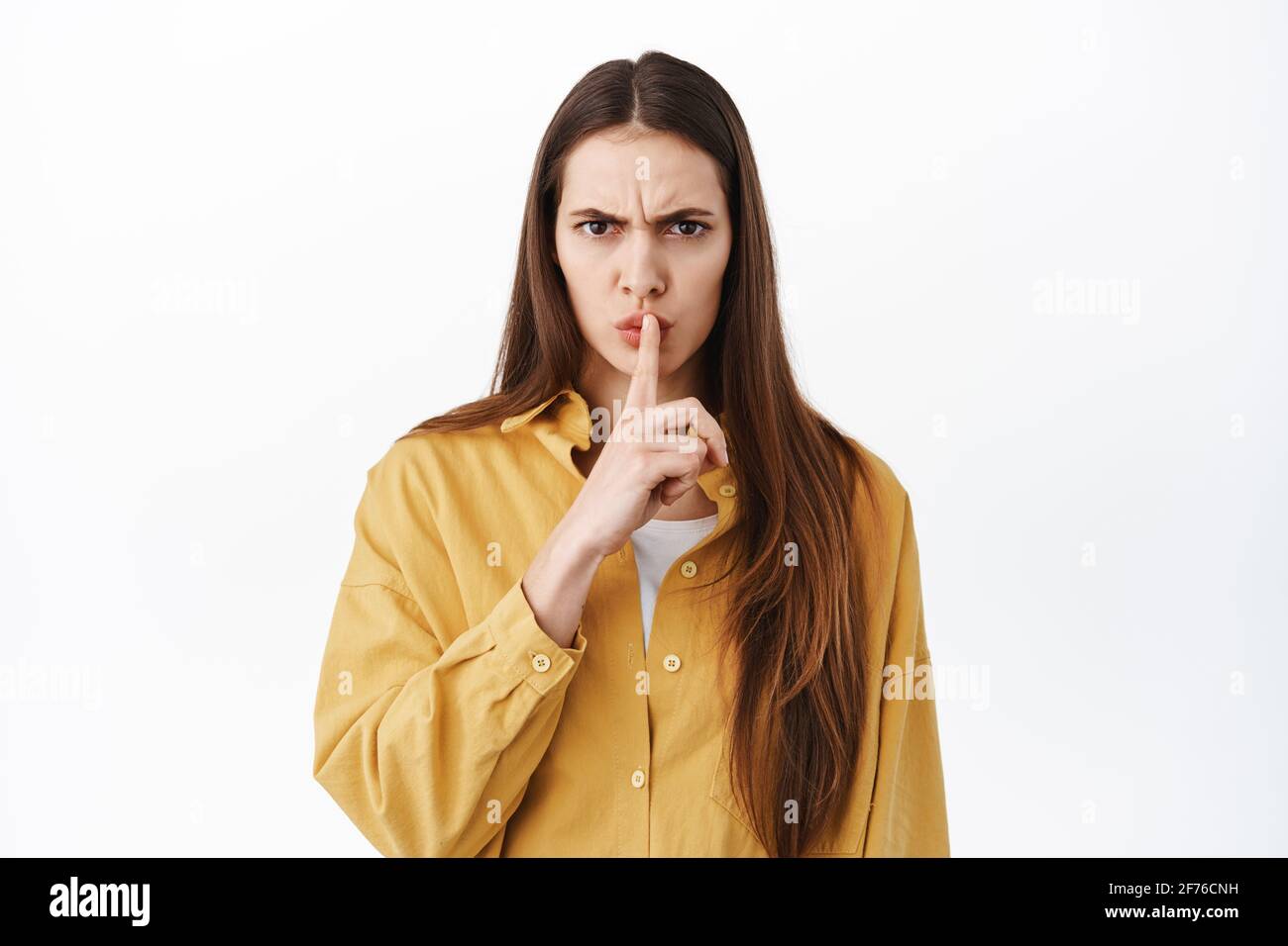 Finger over mouth quiet hi-res stock photography and images - Alamy