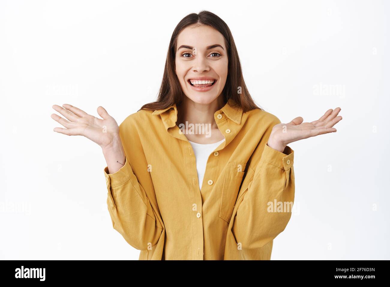 Image of attractive natural girl feeling pleased and happy, clap hands ...