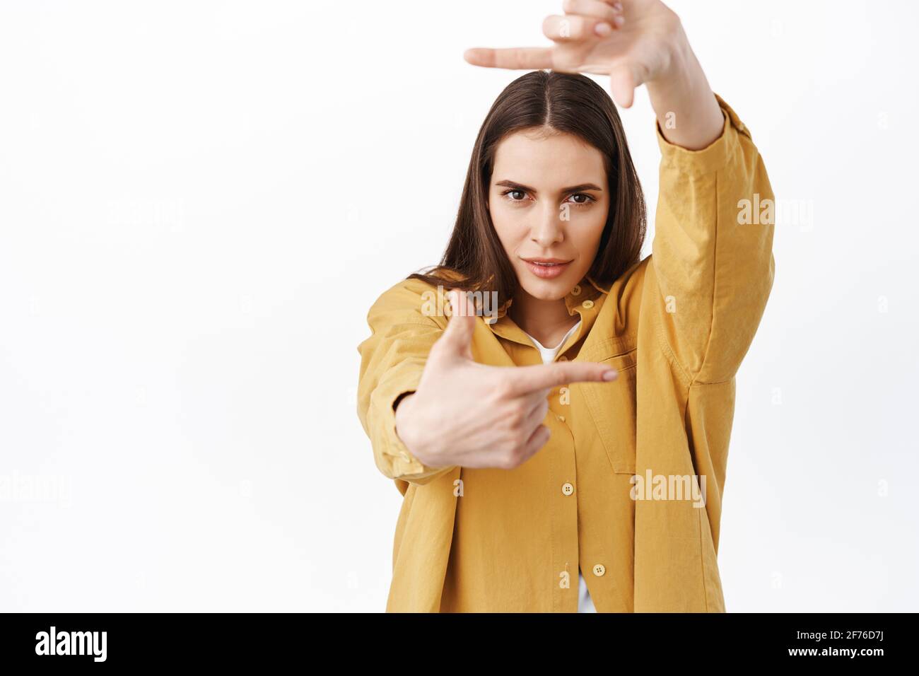 Creative and passionate woman searching perfect angle, looking through ...