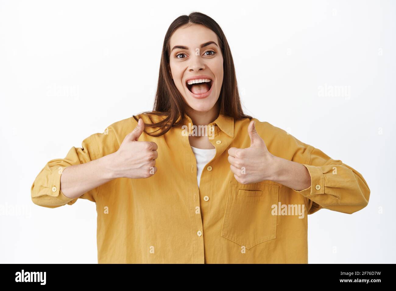 Excited and supportive girlfriend shows thumbs up, stay positive ...