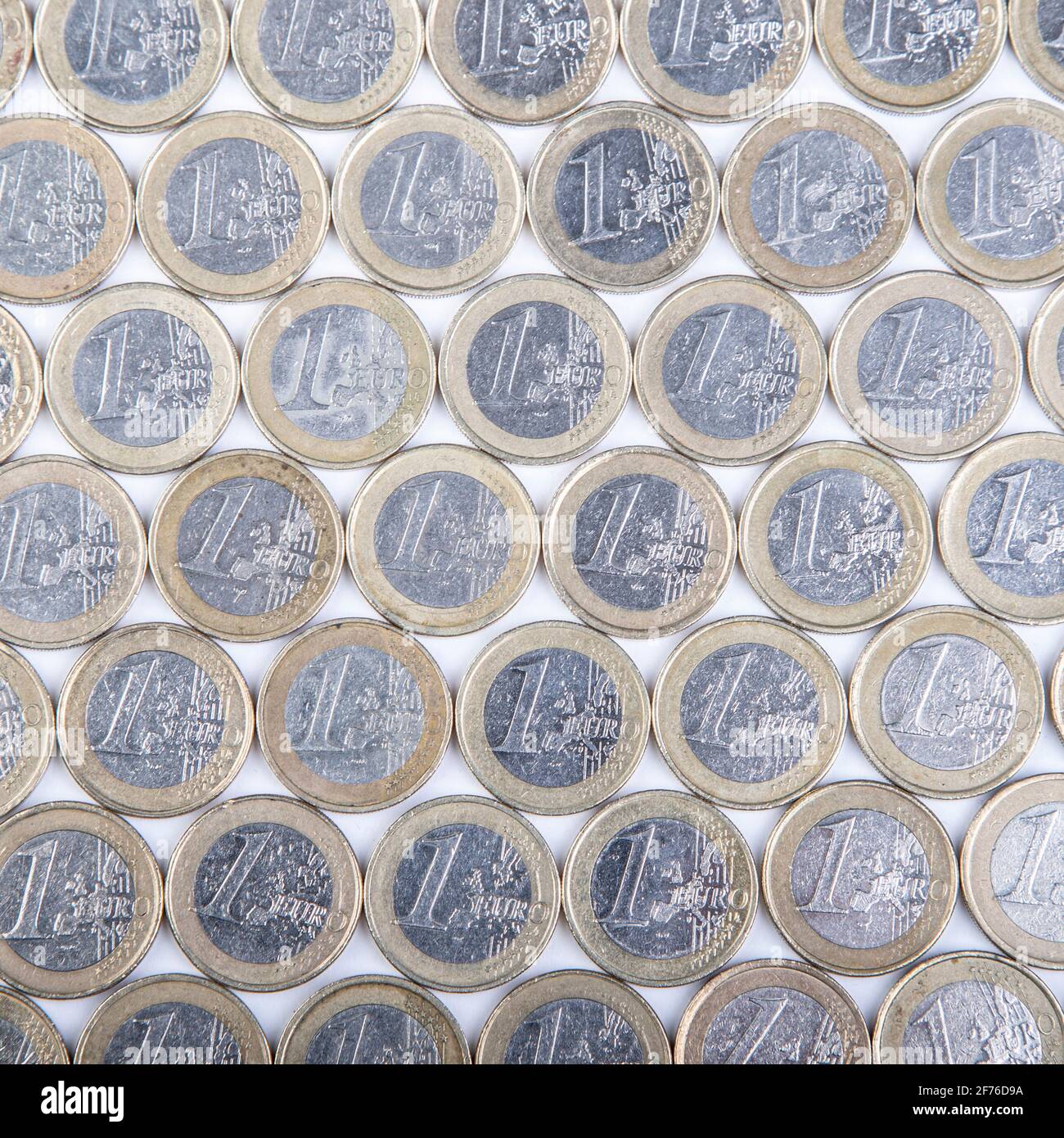 one euro coins in a row as background Stock Photo - Alamy
