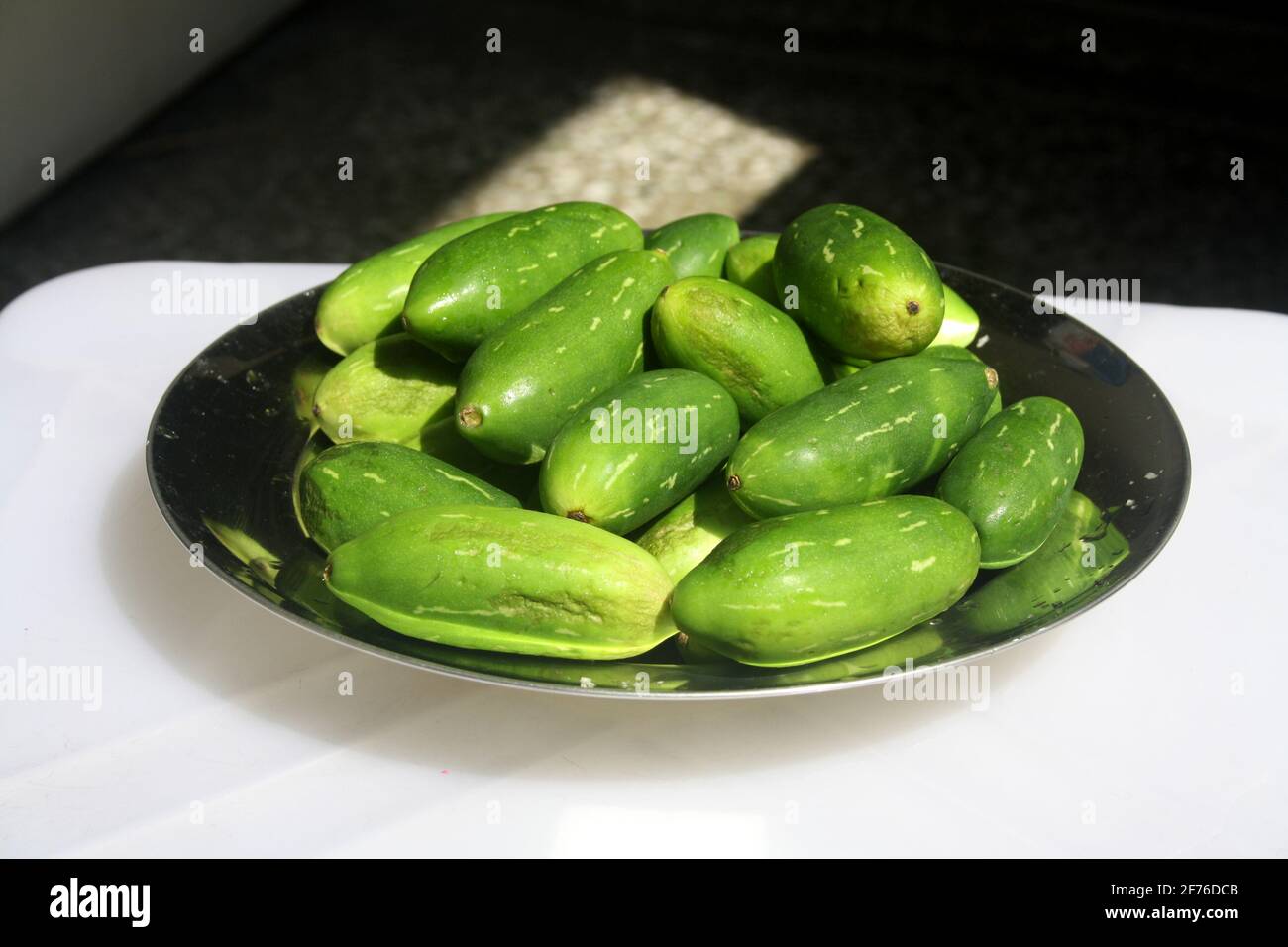 Edible Ivy gourd or Kundru (Coccinia grandis) in a bowl Stock Photo - Alamy