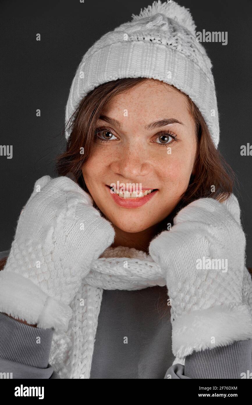 Cute woman wrapped up warm in winter clothes Stock Photo - Alamy