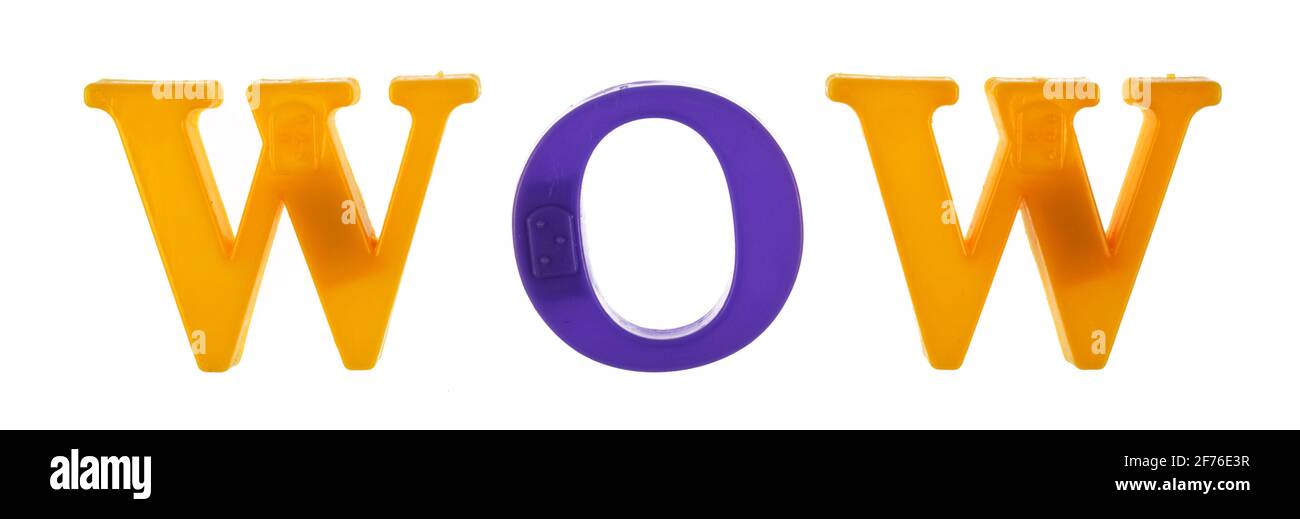 Word wow is lined with multicolored plastic letters on magnets ...