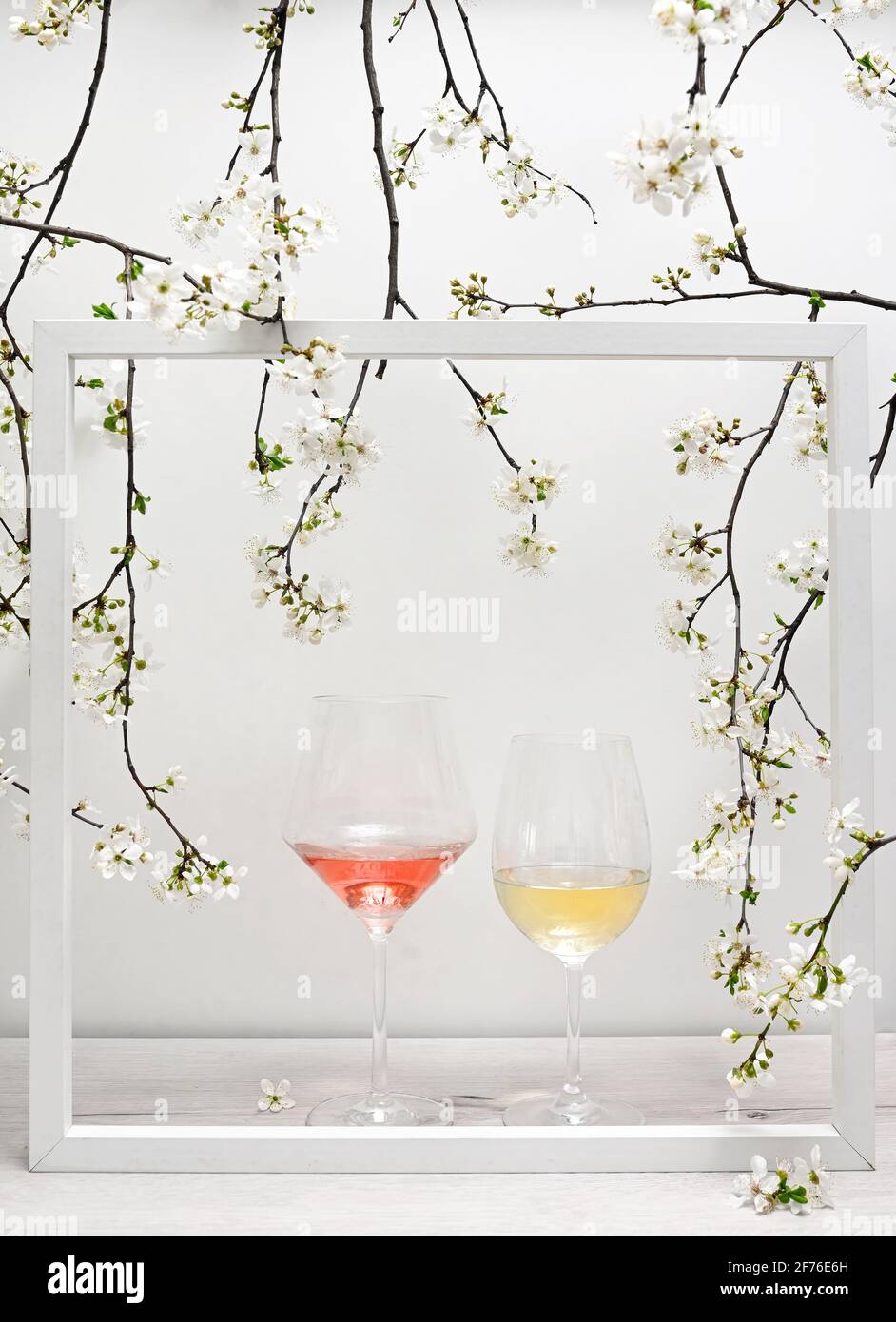 Glasses Of Rose and White Wine Inside A Frame with Cherry Blossom Stock ...