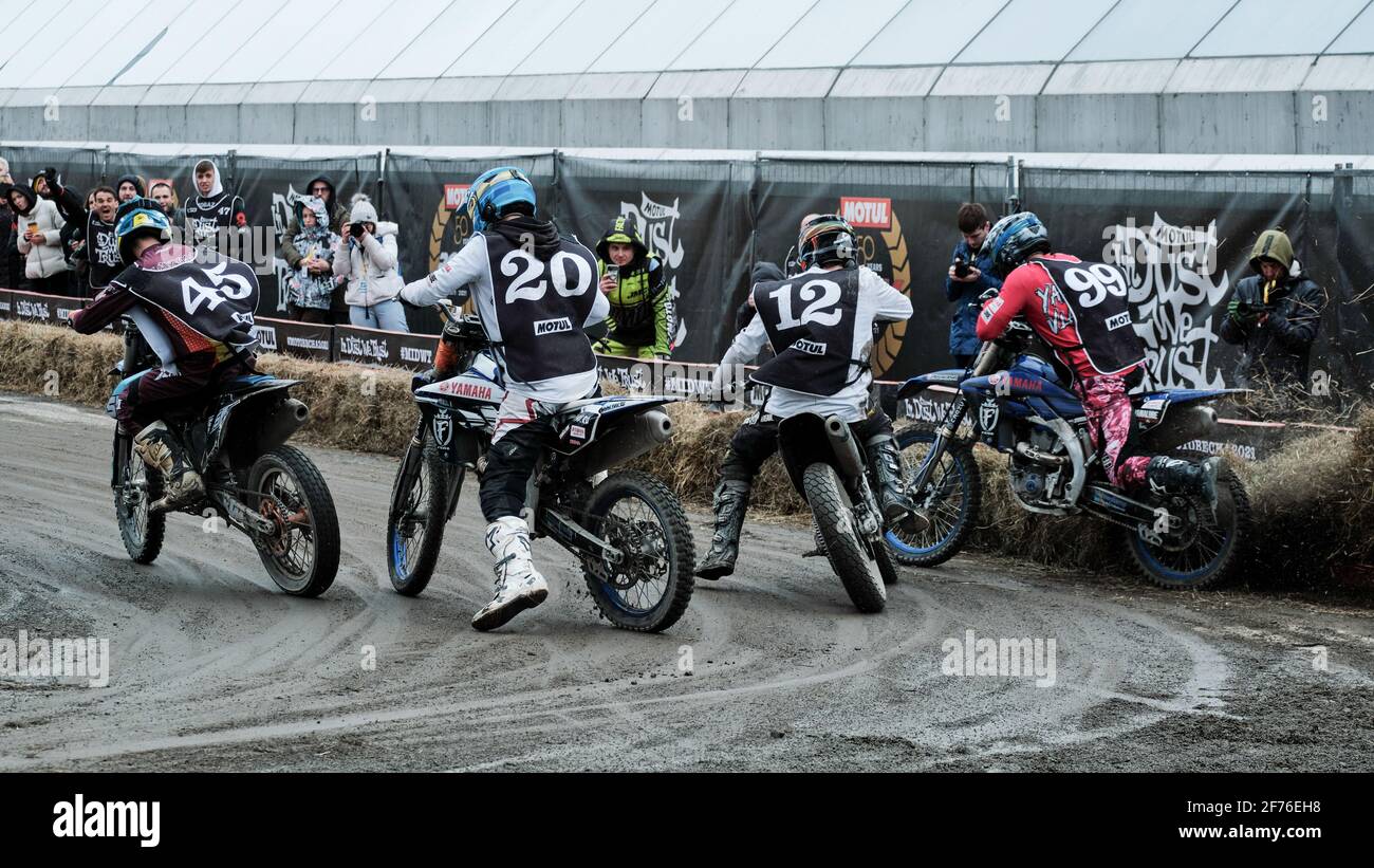 Motorcycle race competitors taking a corner during the exhibition. The ...