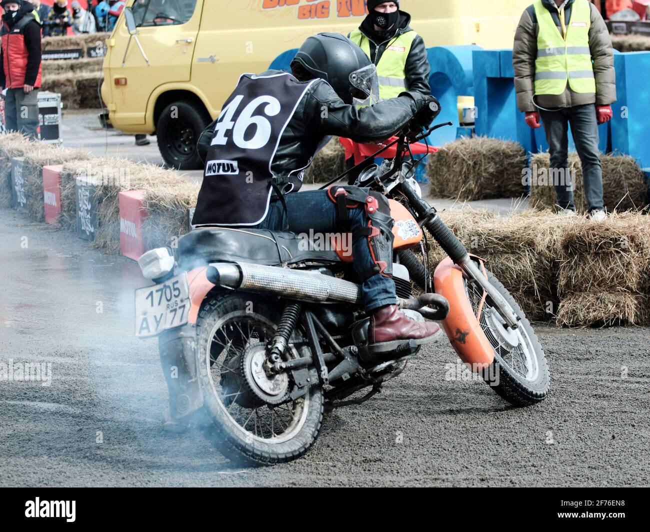 A motorcycle race participant competing during the exhibition. The ...