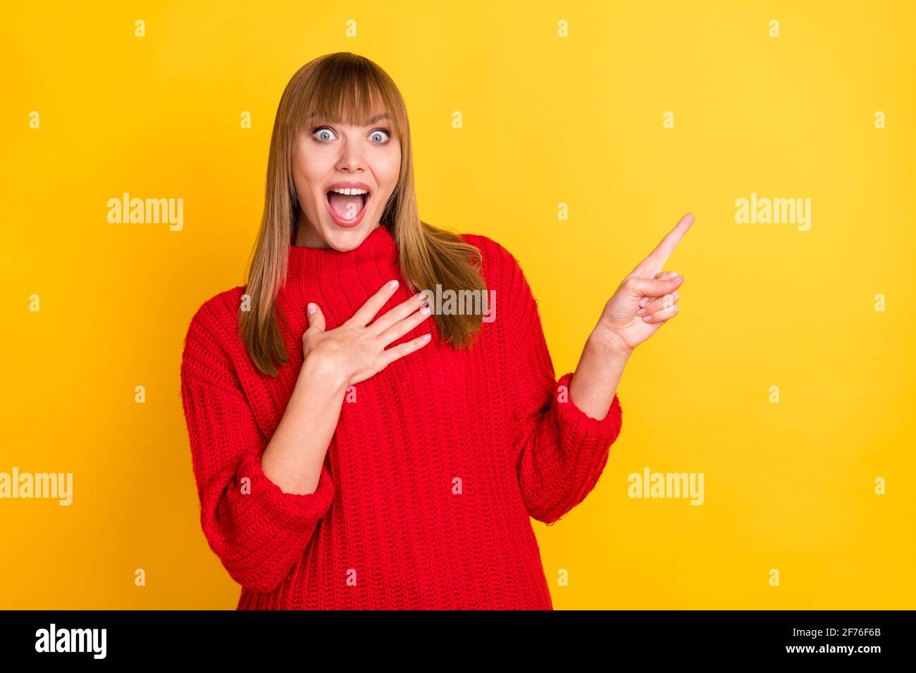 Photo of blond impressed lady look point empty space wear red sweater ...