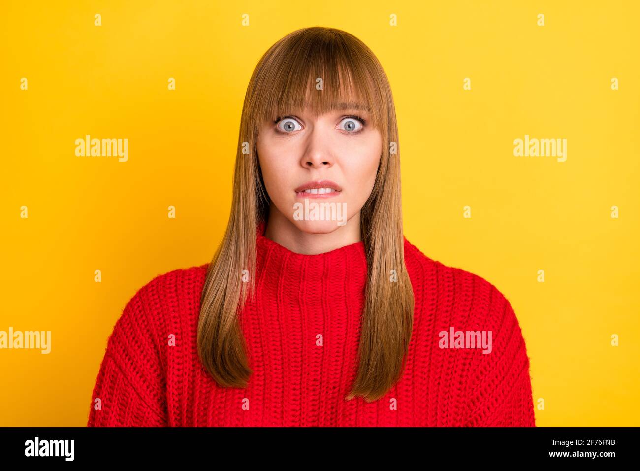 Photo of blond impressed lady bit lip wear red sweater isolated on ...