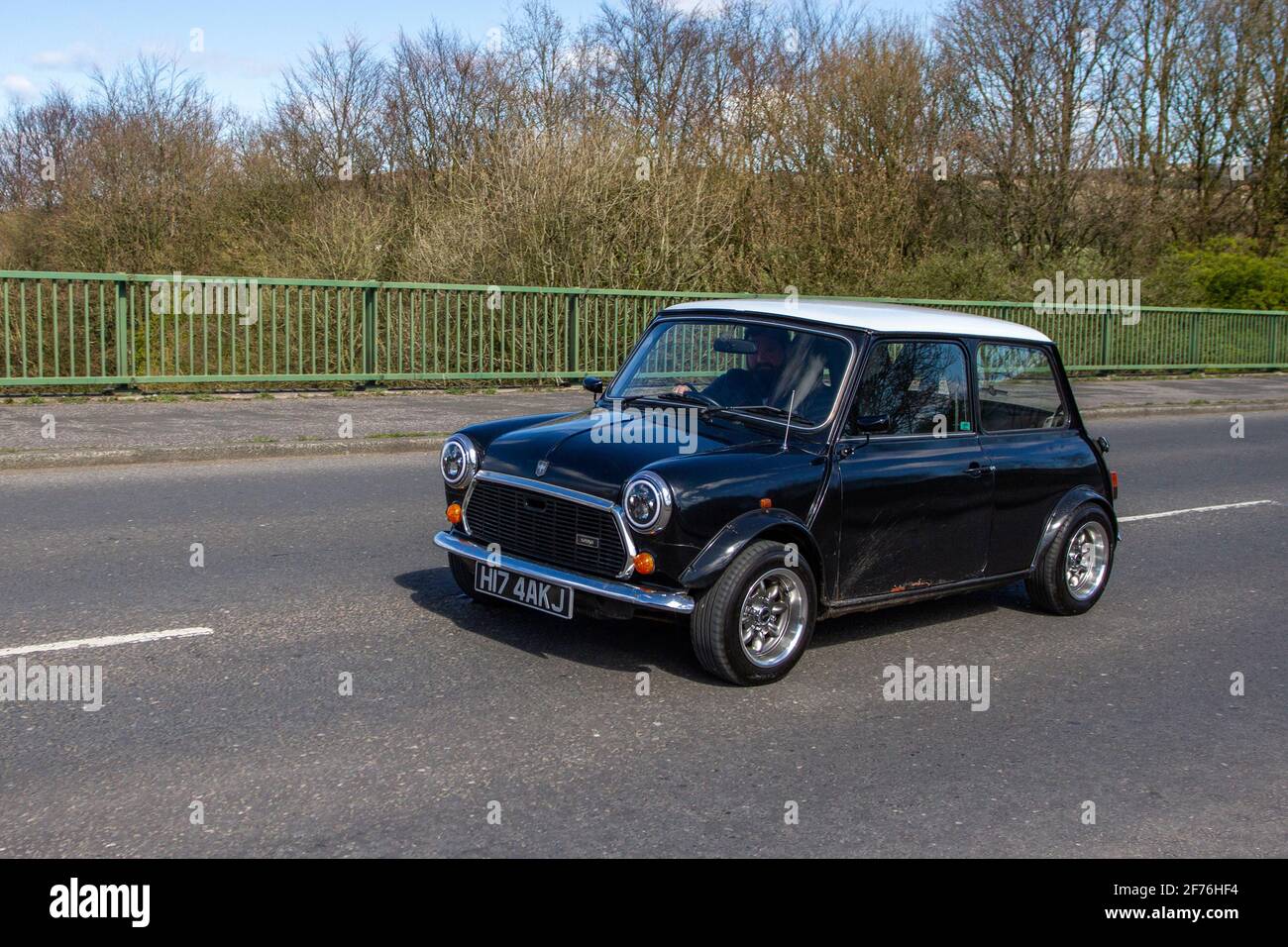 1990 90s black Mini Checkmate Racing, 998cc saloon; vehicular traffic ...