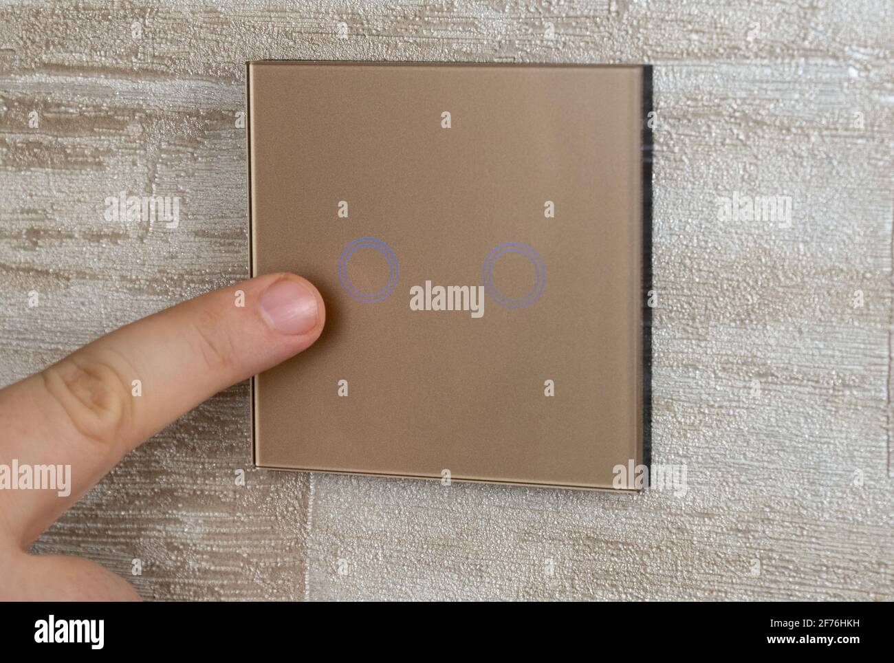 press the touch switch button with your finger. selective focus ...