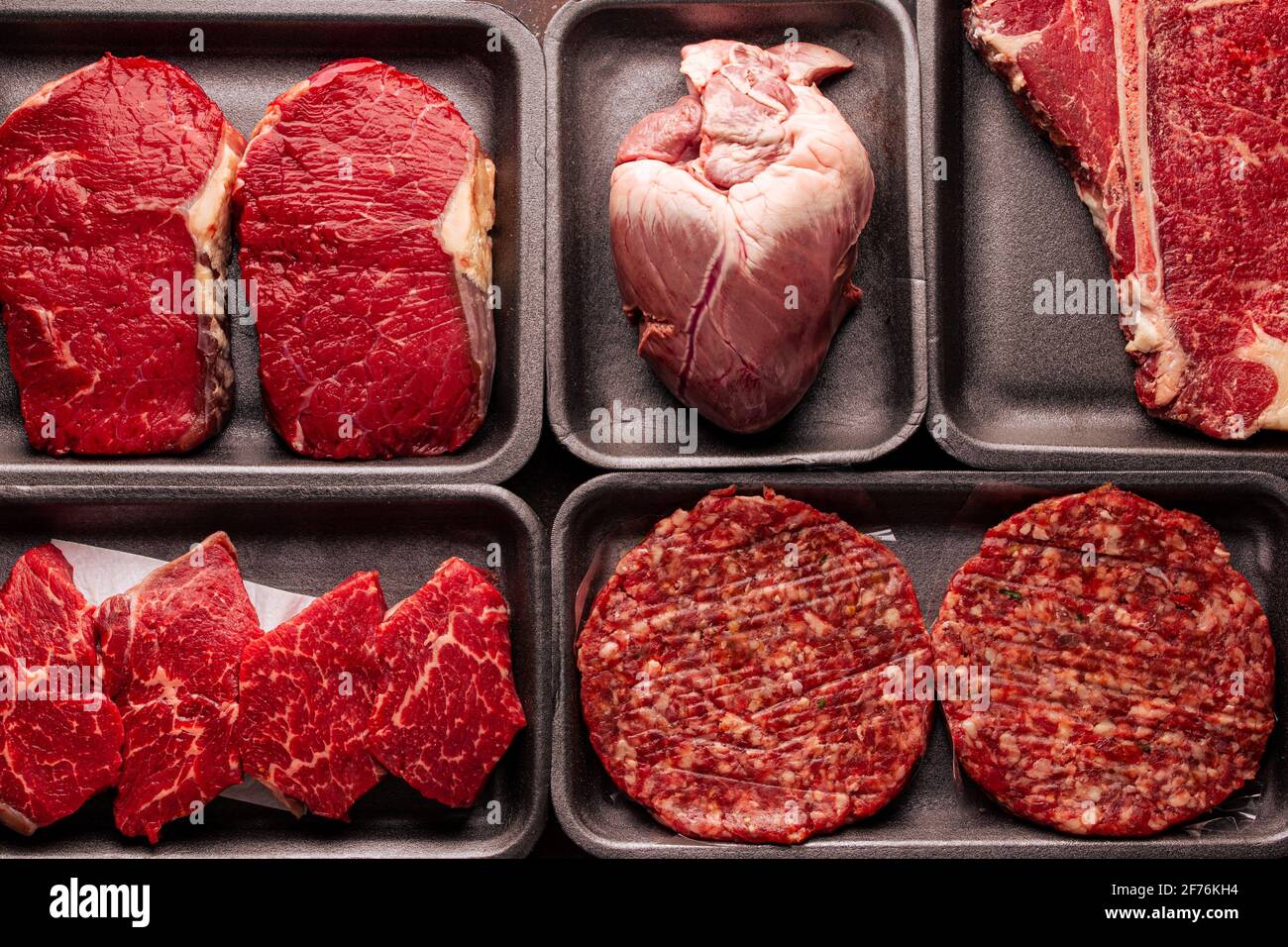 Assorted raw beef meat in plastic boxes Stock Photo - Alamy
