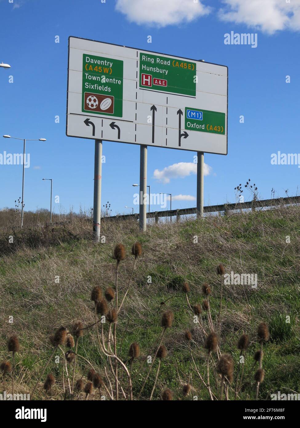 Highway Code: a road sign with the lane markings and directions at a ...