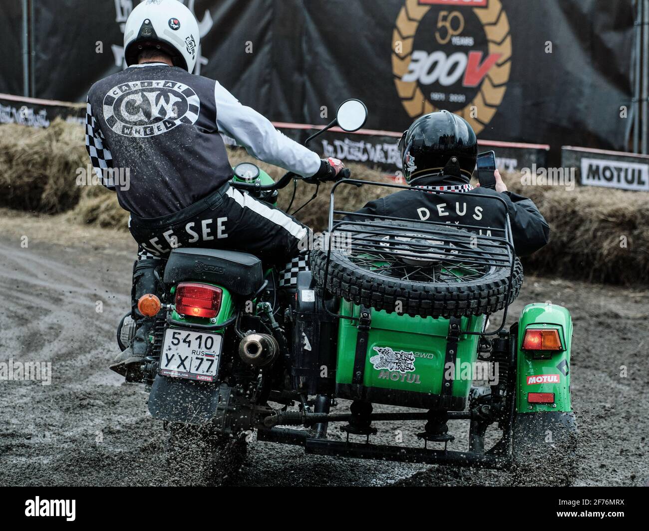 Moscow, Russia. 04th Apr, 2021. Competitors seen on a motorcycle with a ...