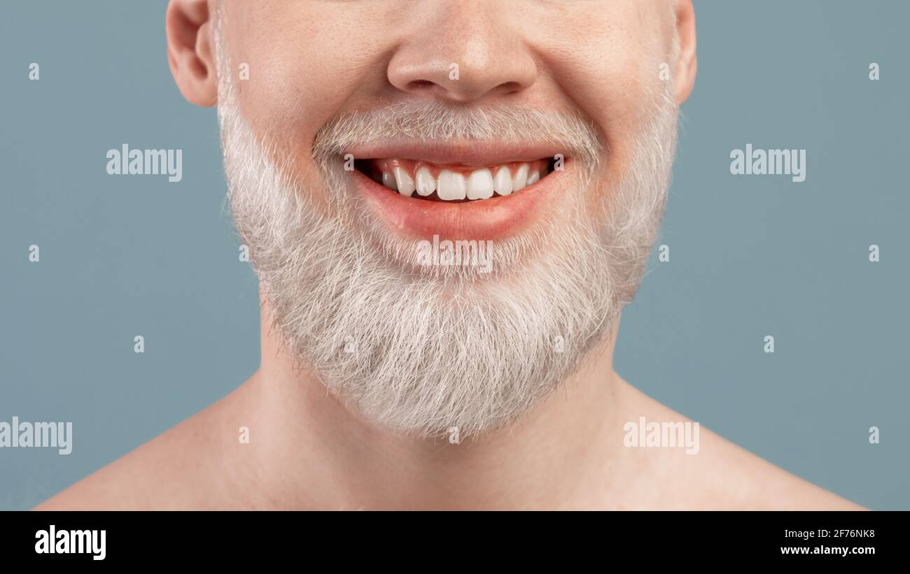 Cropped portrait of albino man with wide beaming smile and healthy ...