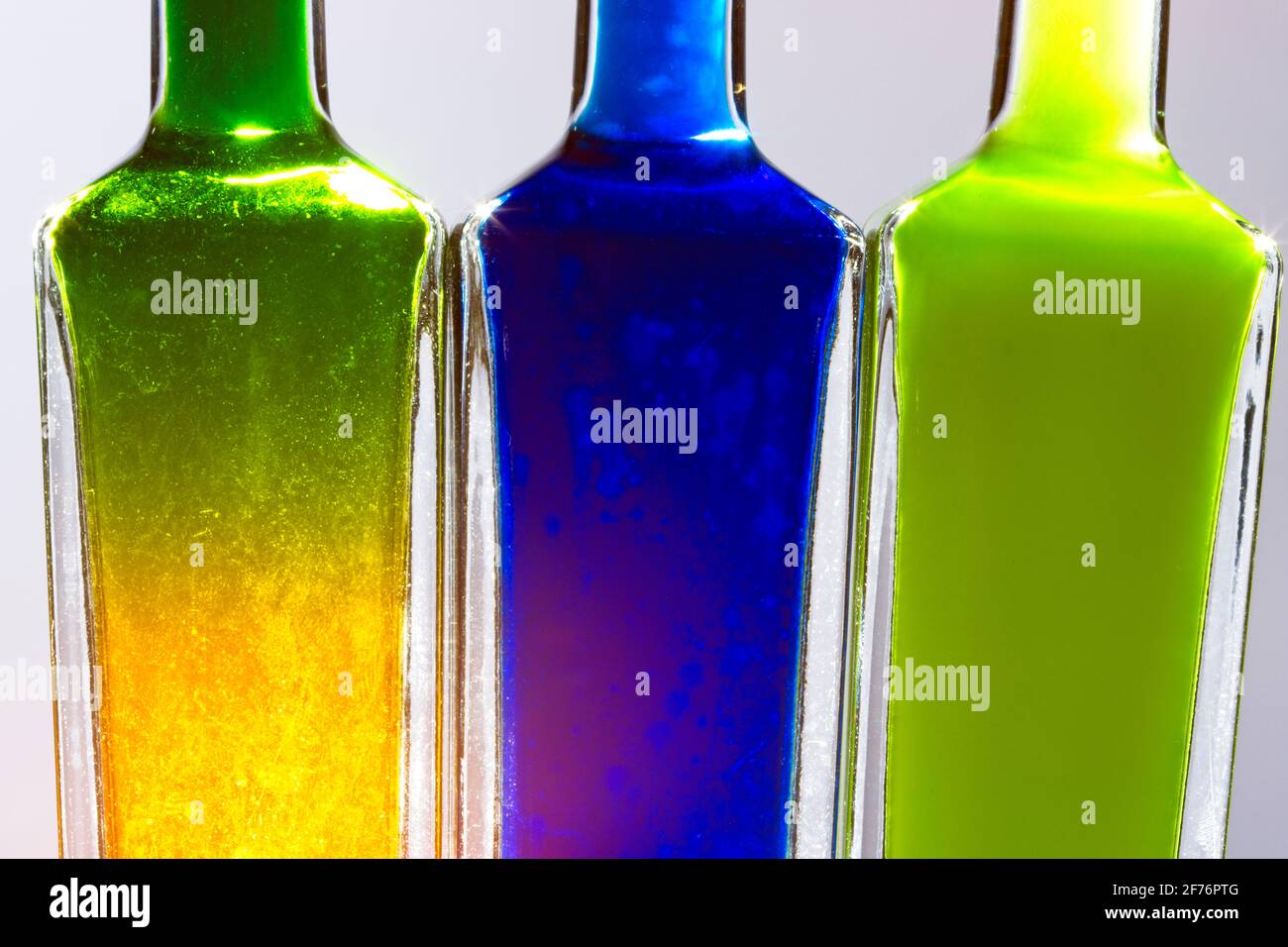 Abstract coloured colored bottles on a white background Stock Photo - Alamy