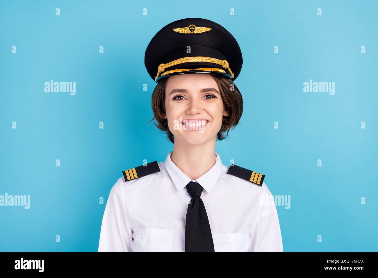 Photo of charming cheerful young pilot lady wear uniform plane crew ...