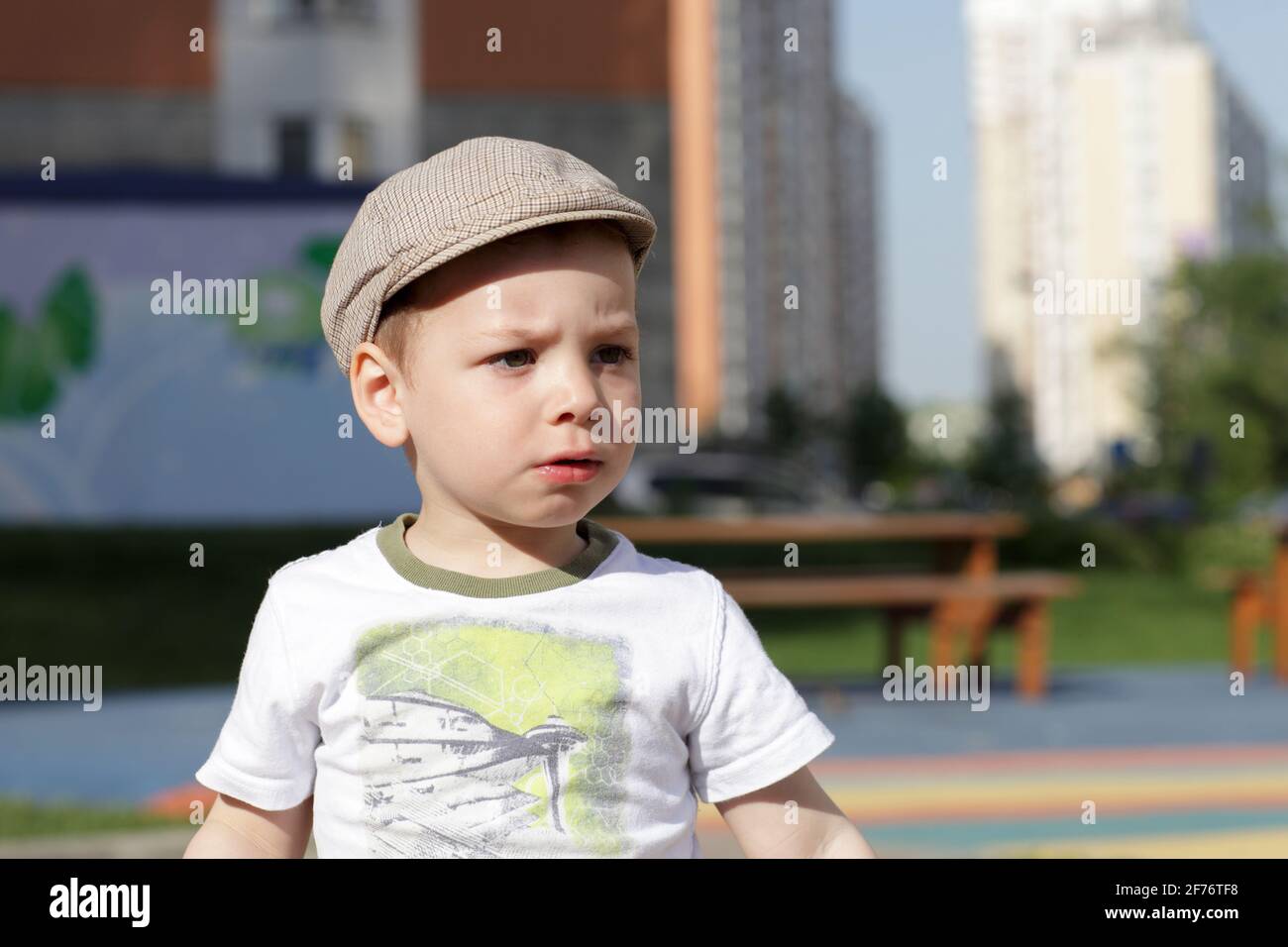 Portrait of a serious kid on a playground Stock Photo - Alamy