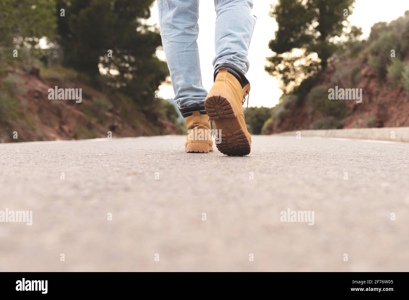 feet of a traveler on the road Stock Photo - Alamy