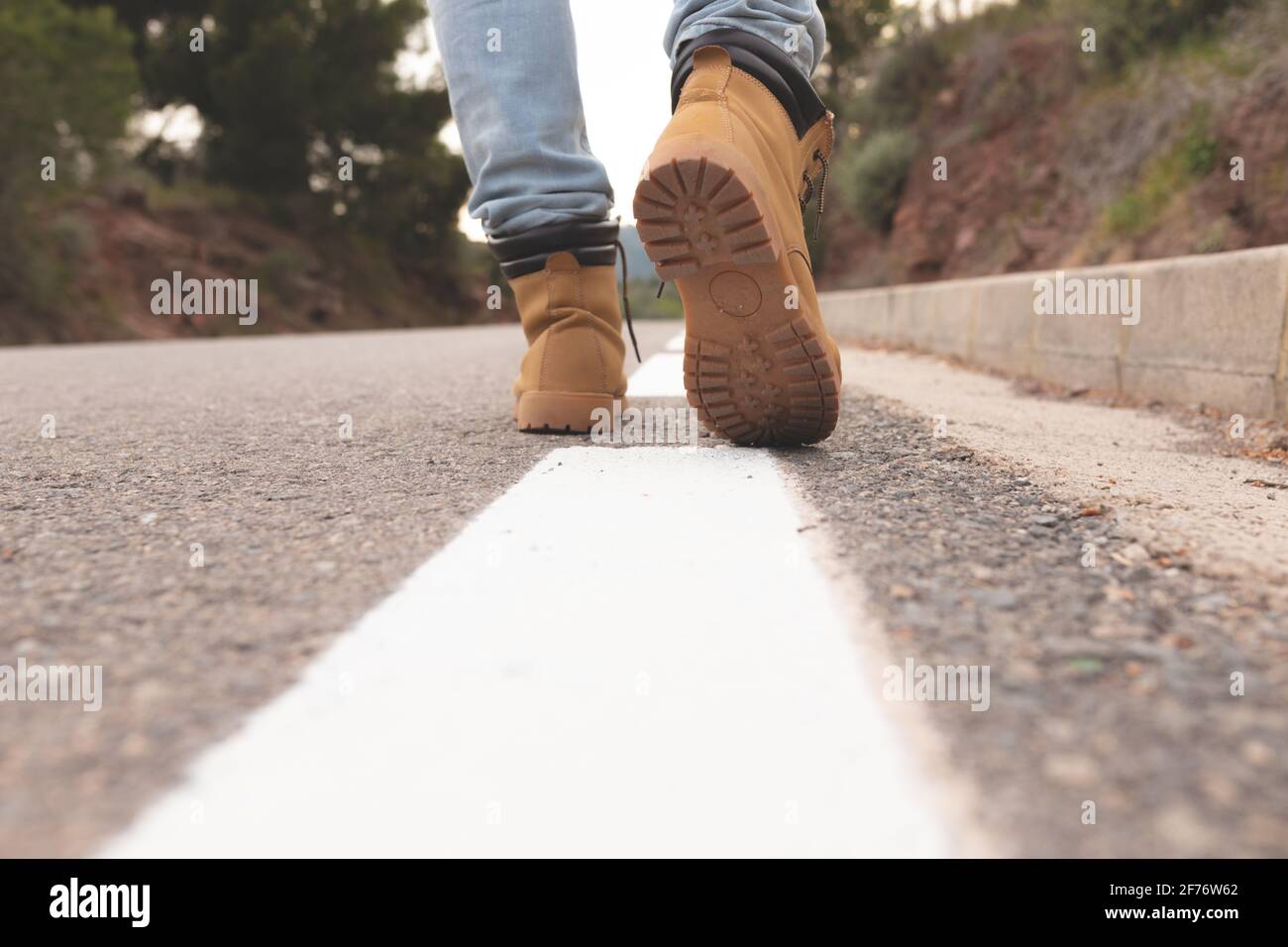 feet of a traveler on the road Stock Photo - Alamy