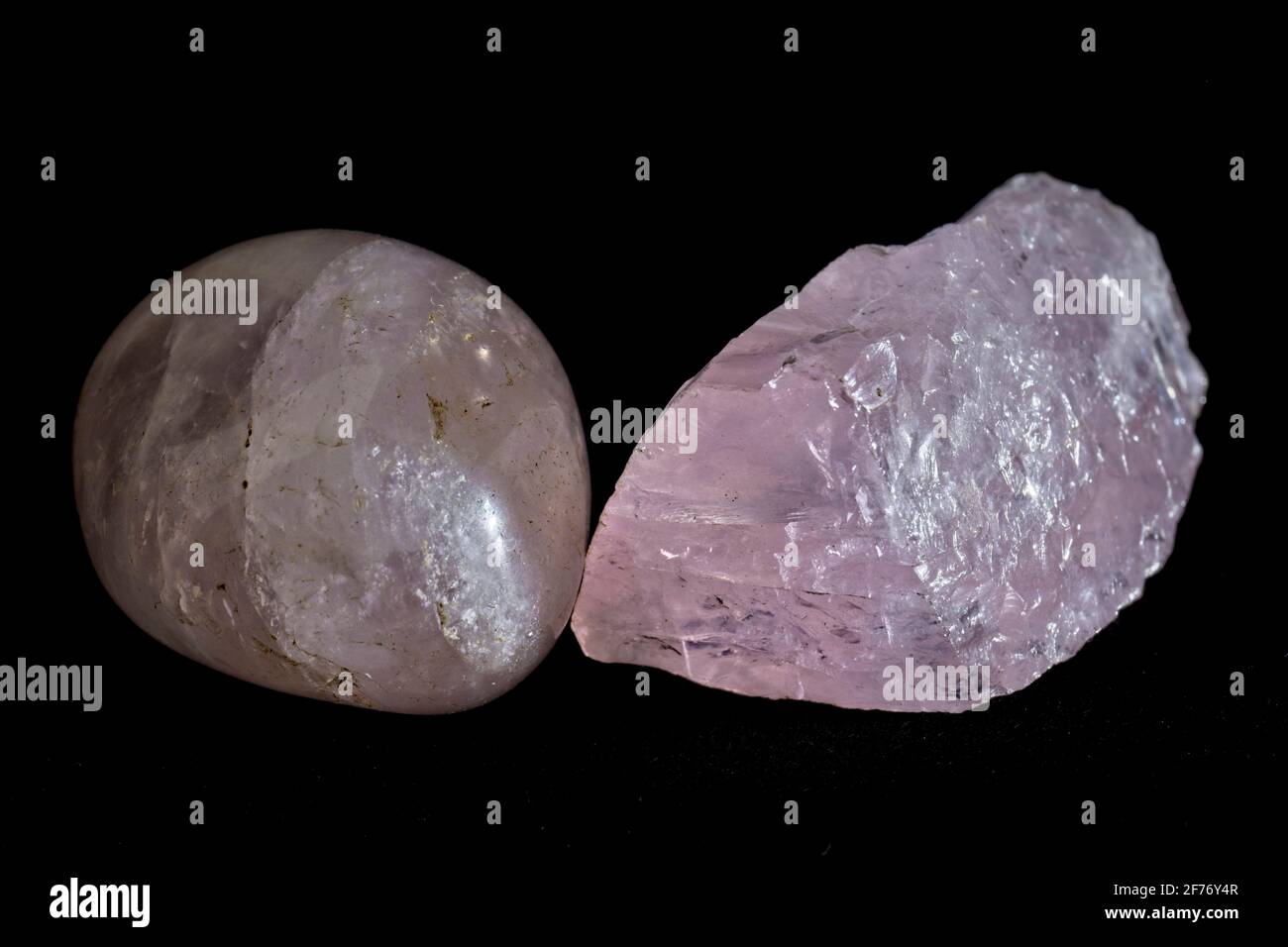 Pink healing crystals on a black background Stock Photo - Alamy