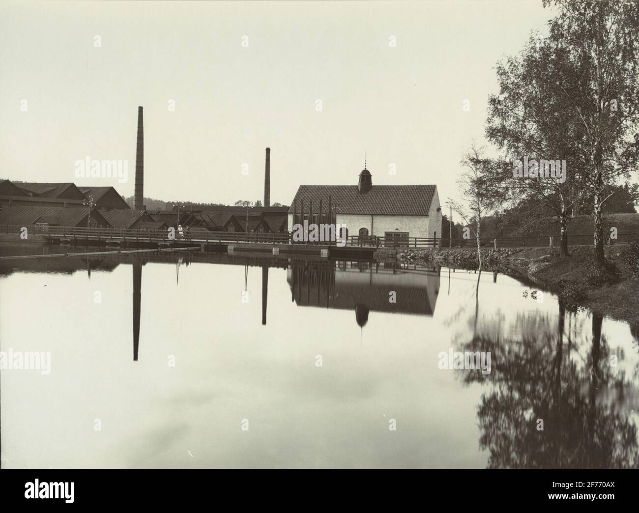 Boxholm's ironworks. View of the fleme pond with the power station and ...