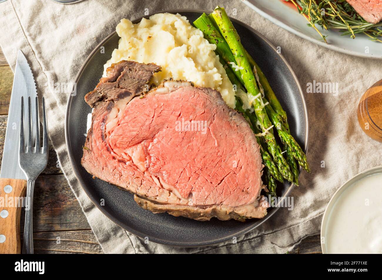 Homemade Prime Rib Beef Roast with Gravy and Herbs Stock Photo - Alamy