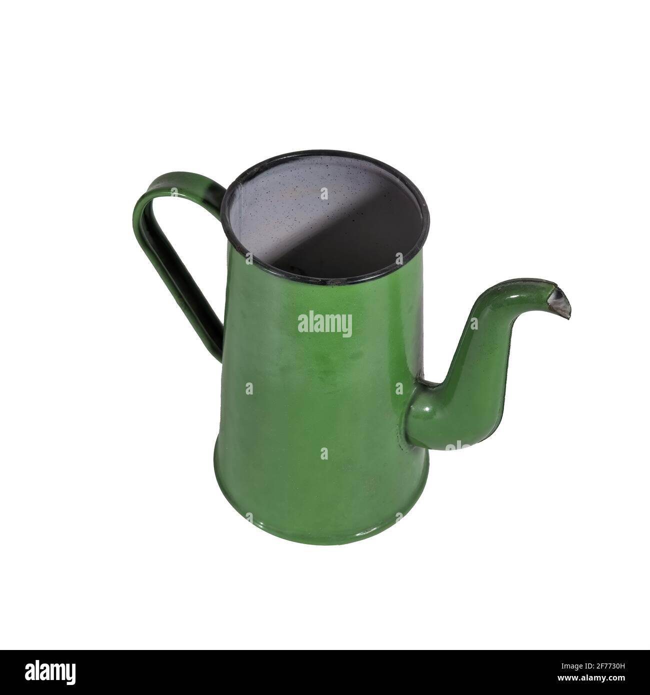 Old metal enameled tea coffee pot of green color isolate on a white ...