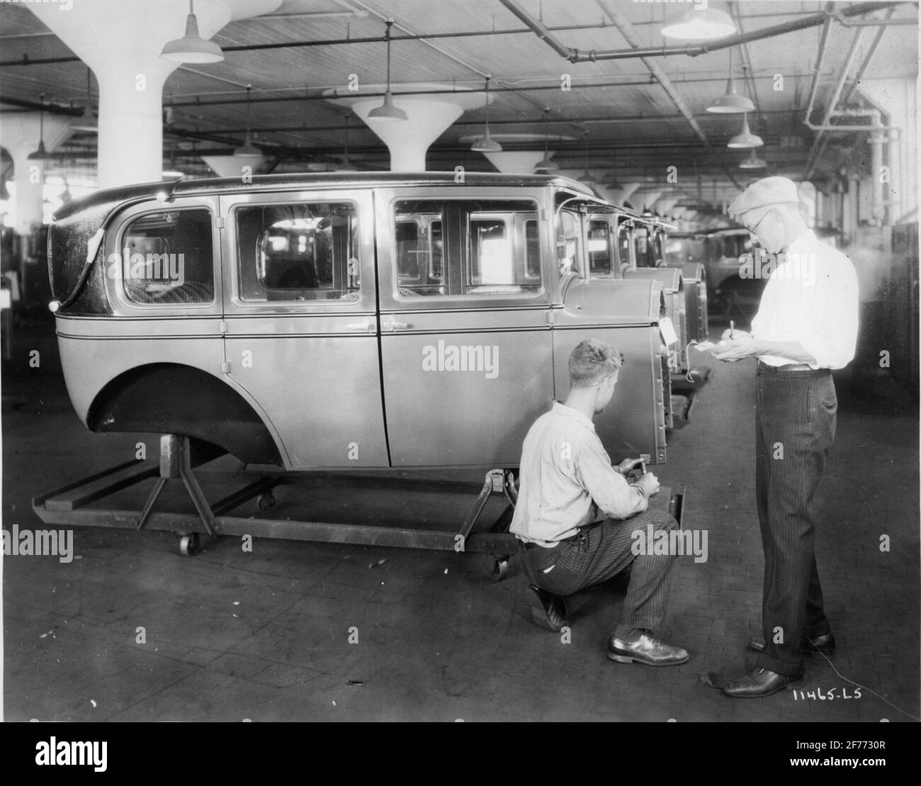 General Motors. A final final inspection of the car body before it is ...