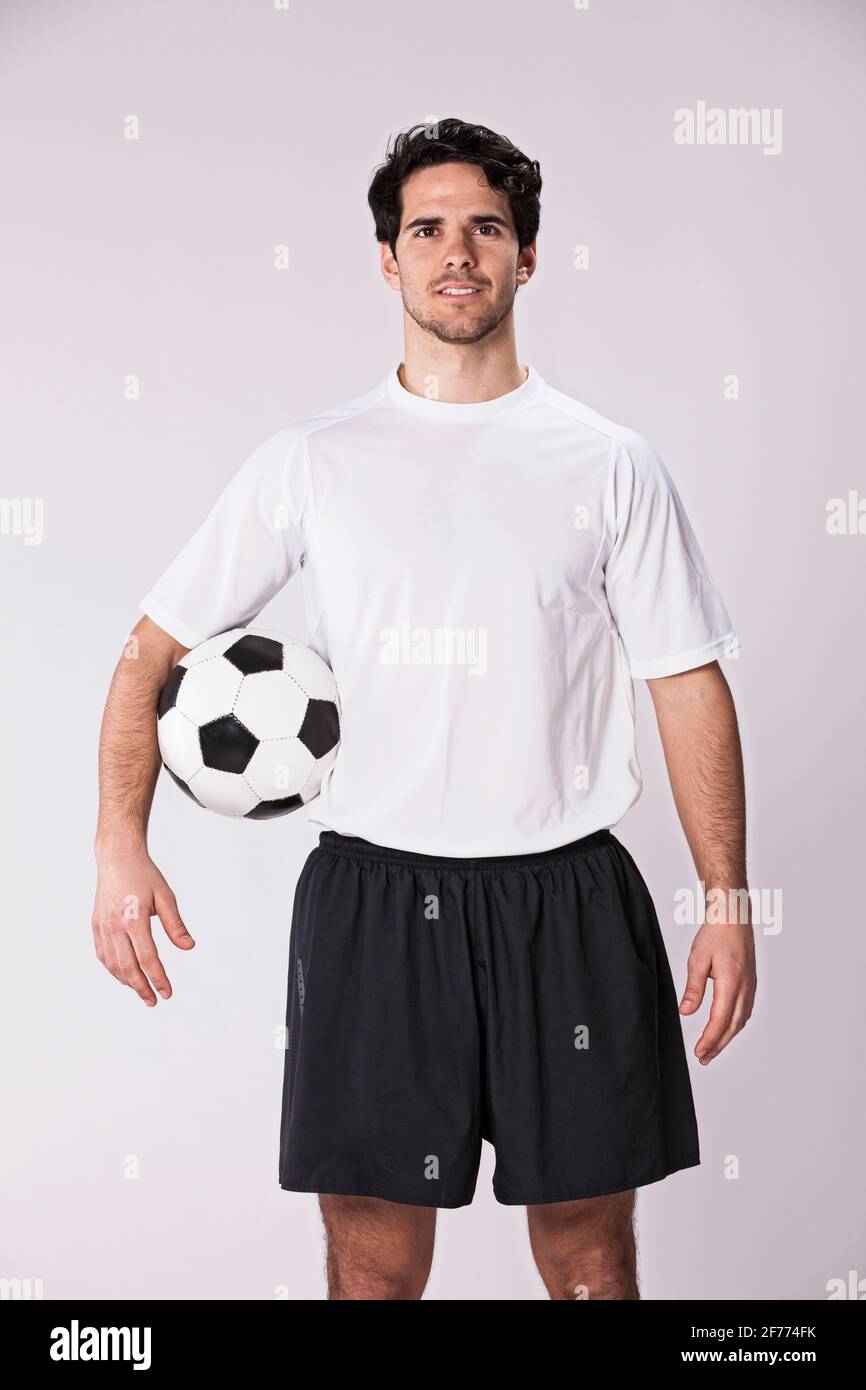 Soccer player kicking a ball hi-res stock photography and images - Alamy