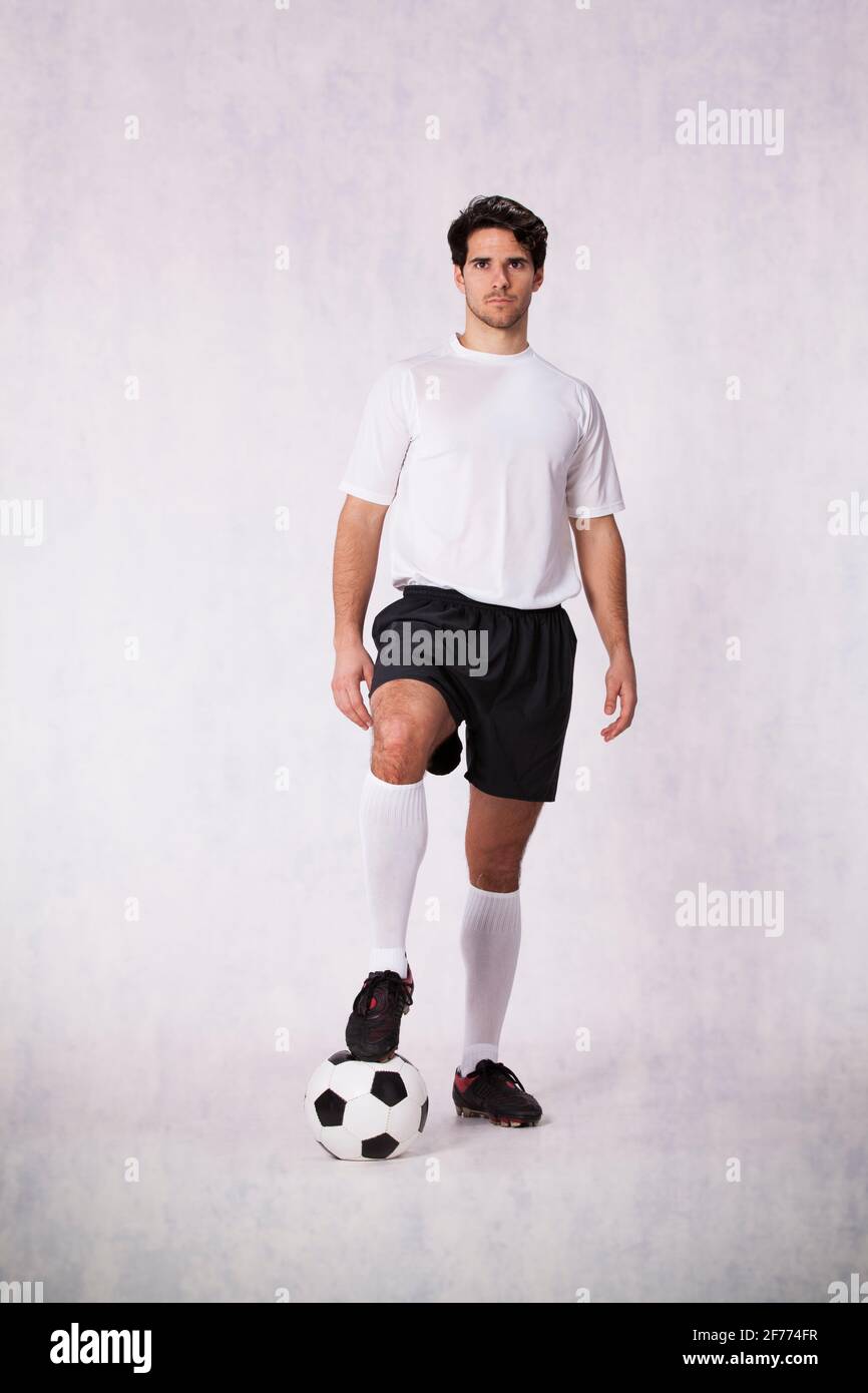 Soccer player with a soccer ball Stock Photo - Alamy