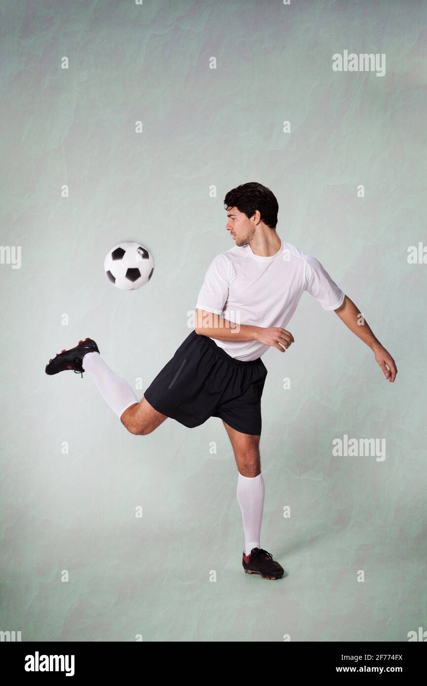 Soccer player with a soccer ball Stock Photo - Alamy