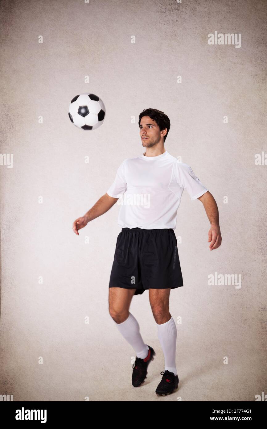 Soccer player with a soccer ball Stock Photo - Alamy
