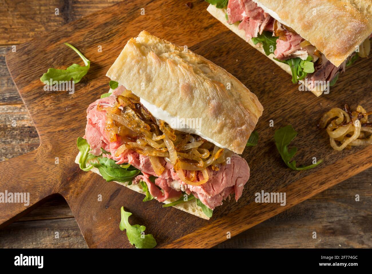Homemade Prime Rib Sandwich Au Jus with Onions Stock Photo - Alamy
