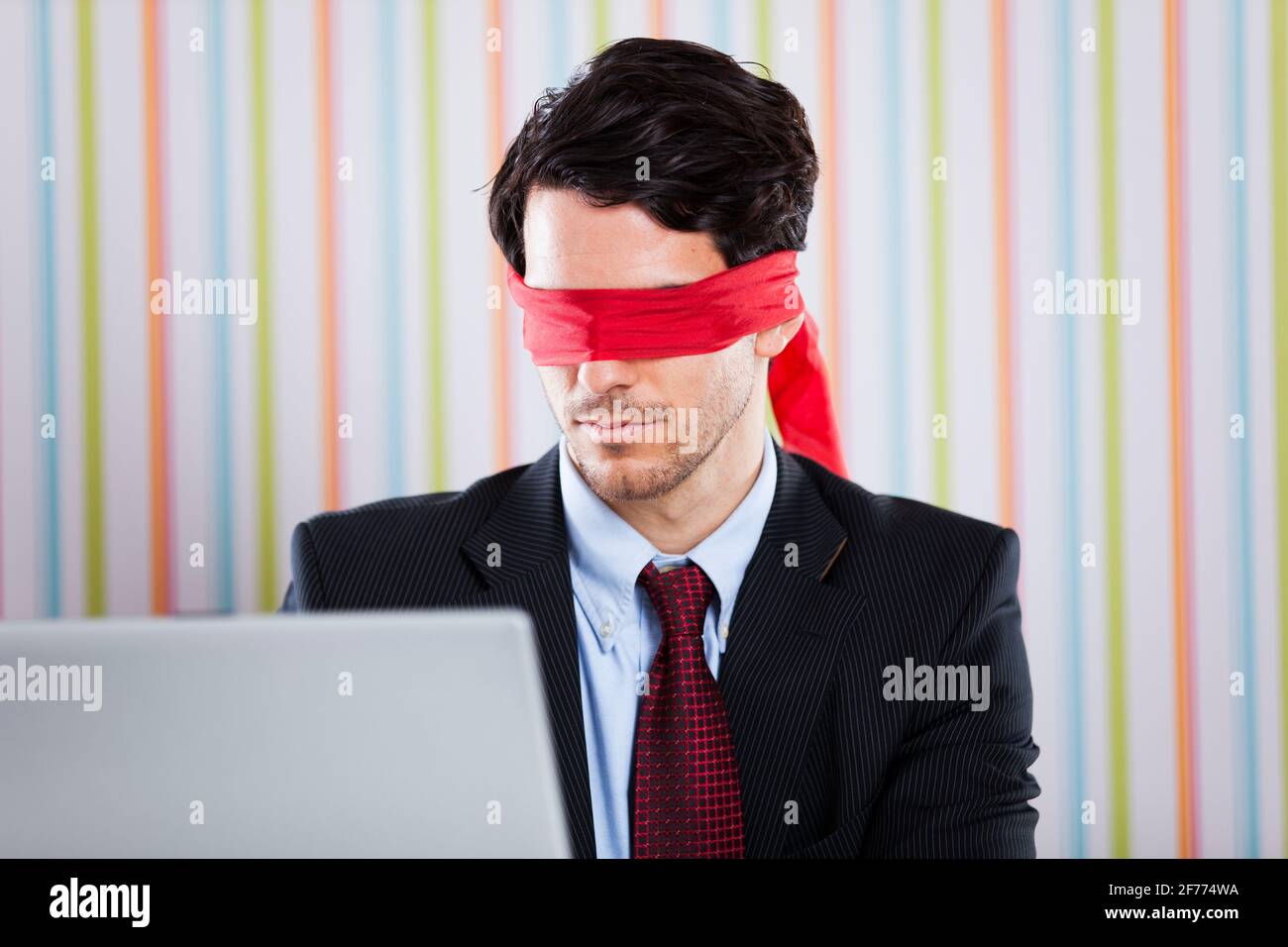 Blind businessman working at the office Stock Photo - Alamy