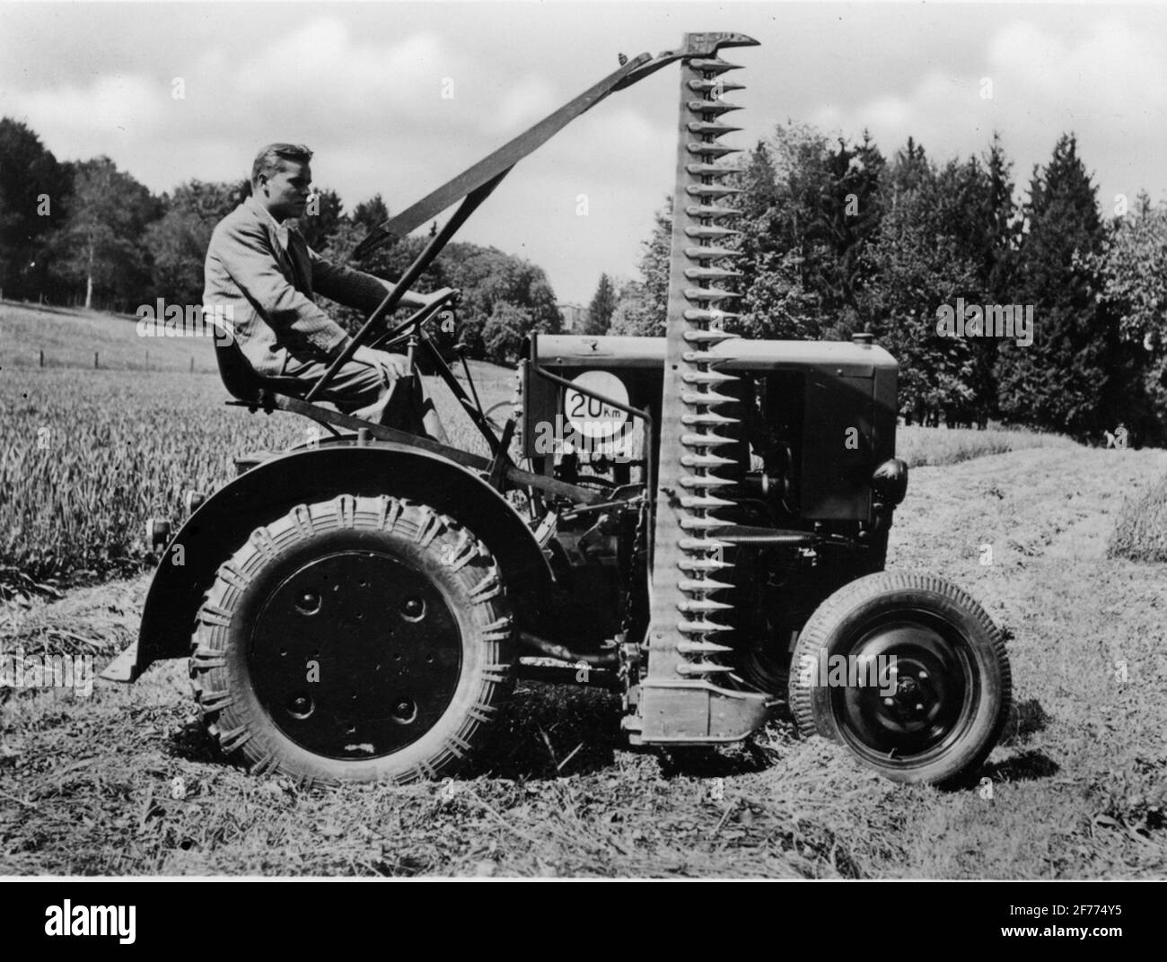 Tractor with mower Stock Photo - Alamy