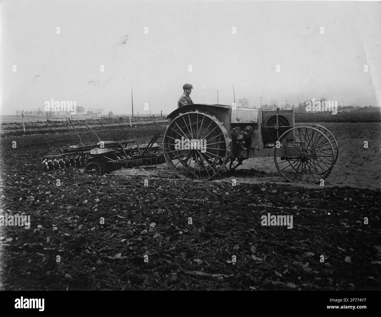 Tractor with plow Stock Photo - Alamy