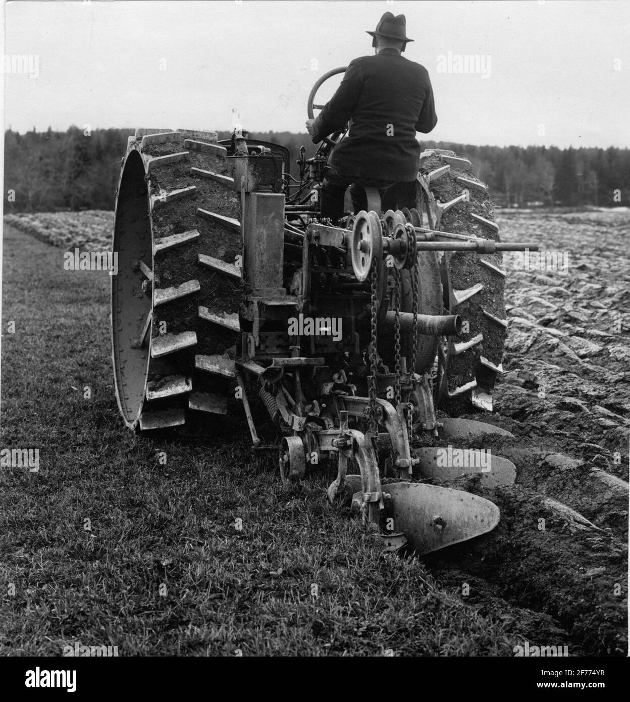Tractor with plow Stock Photo - Alamy