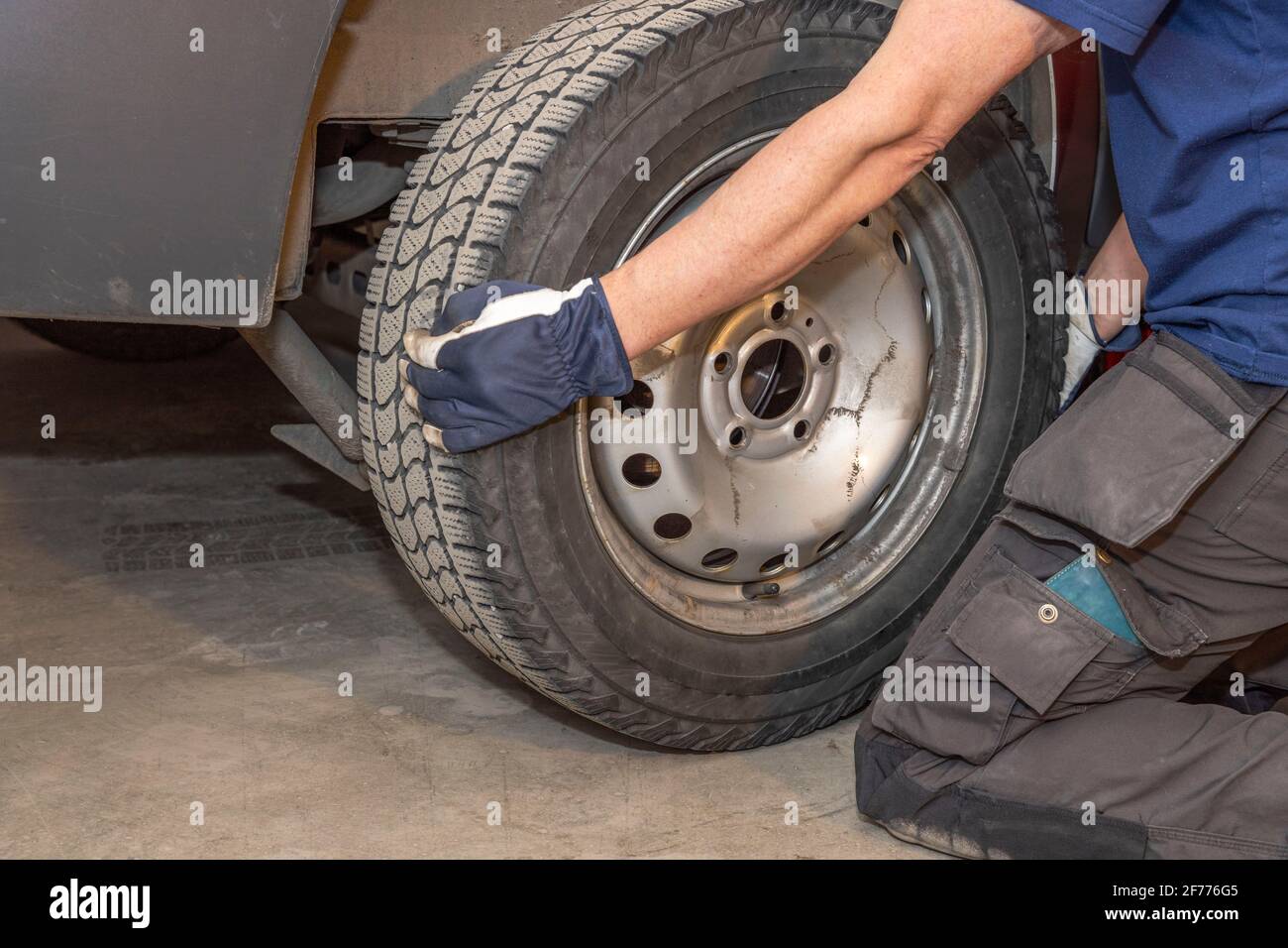 Close up view of man changing tire. Transportation concept. Sweden ...