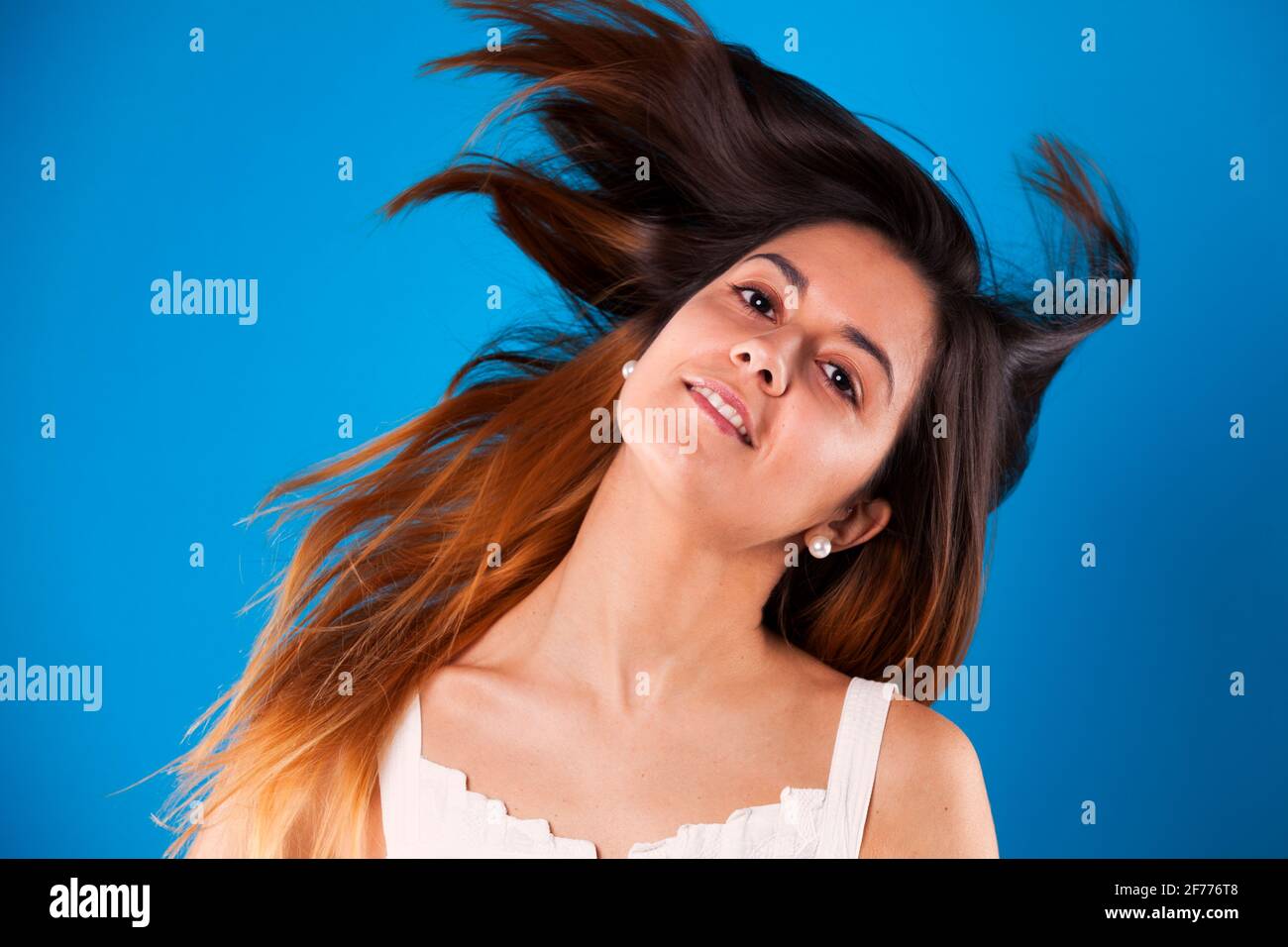 Beautiful woman moving her hair Stock Photo - Alamy