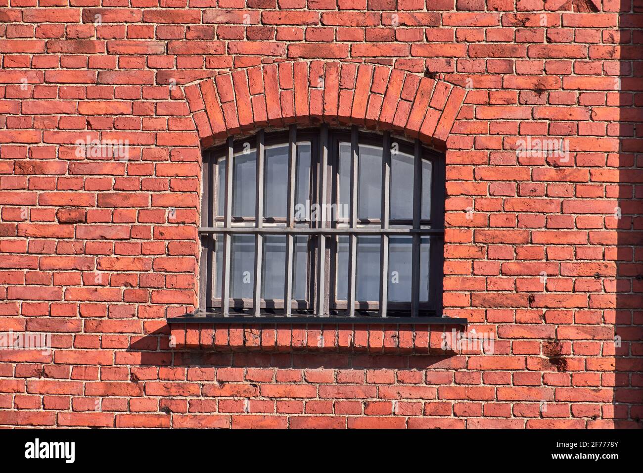 The old prison window on the red brick wall in Helsinki, Finland Stock ...